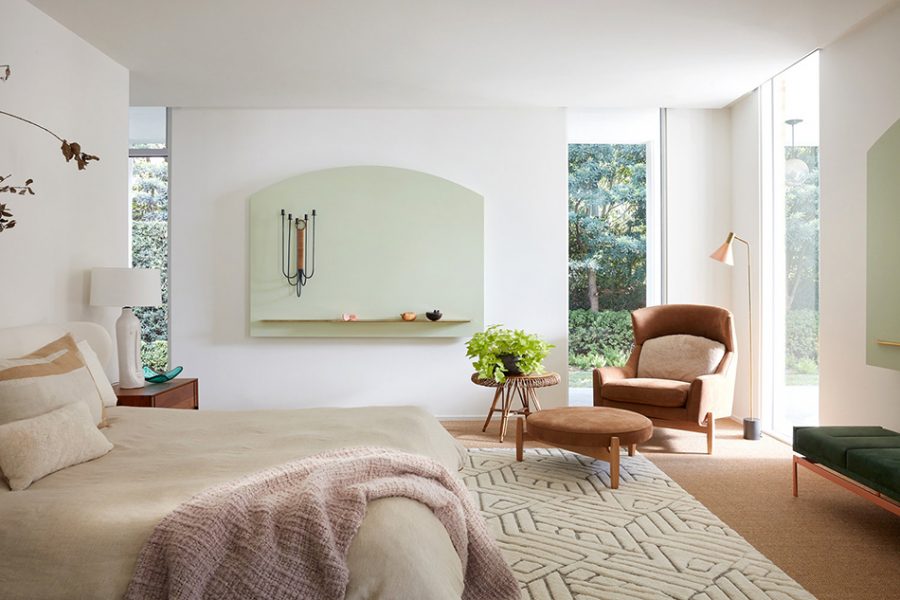 Directly above the Naoto Fukasawa-designed bed’s upholstered headboard ...